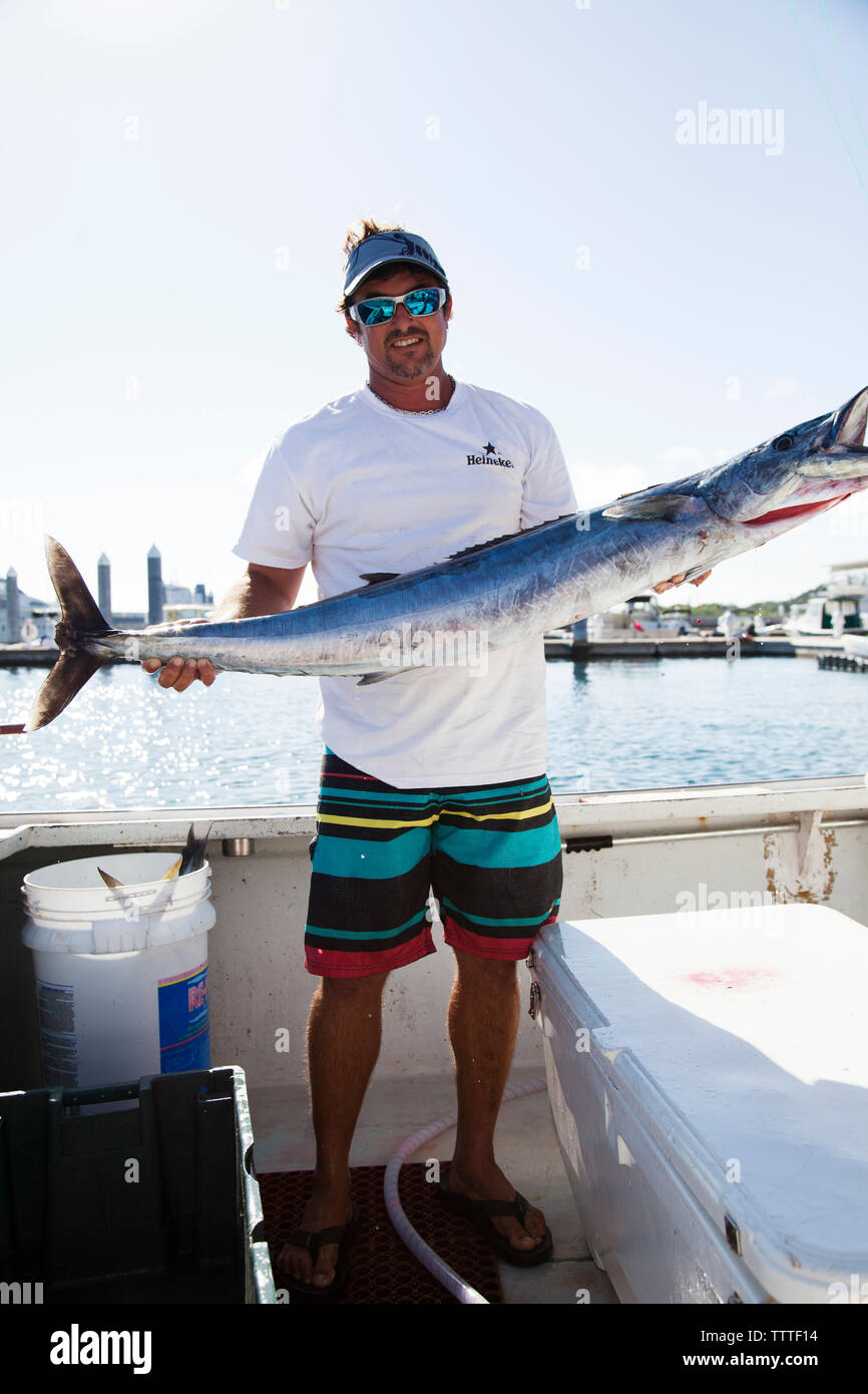 Man male holding fish tuna hi-res stock photography and images - Alamy