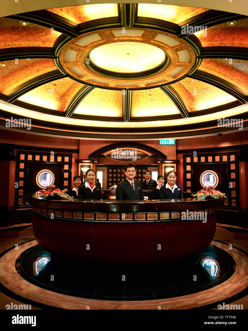 Chinese woman hotel receptionist hi-res stock photography and images ...