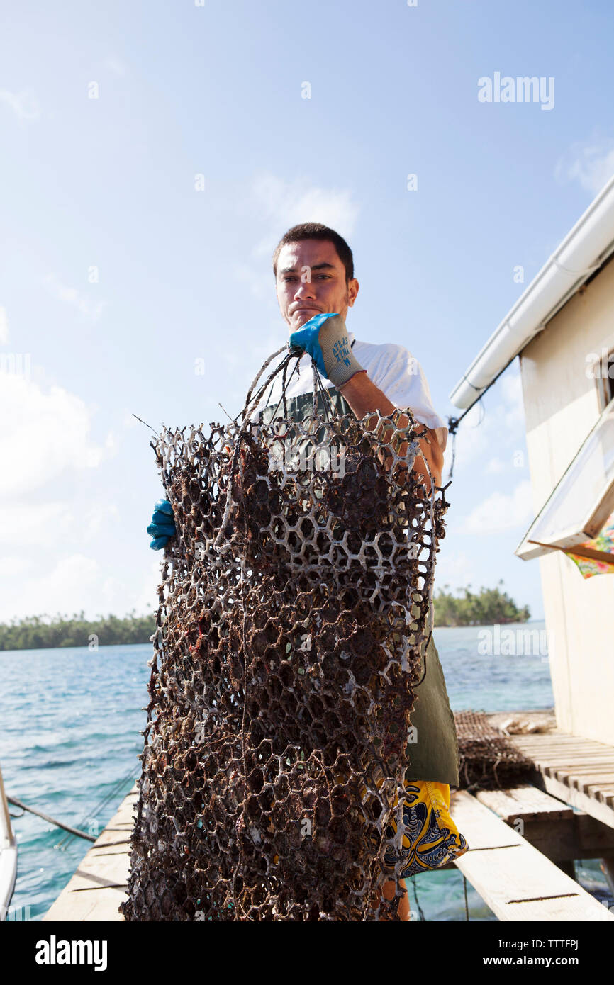 FRENCH POLYNESIA, Raiatea. Harvesting pearls at the Raimana Pearl Farm ...