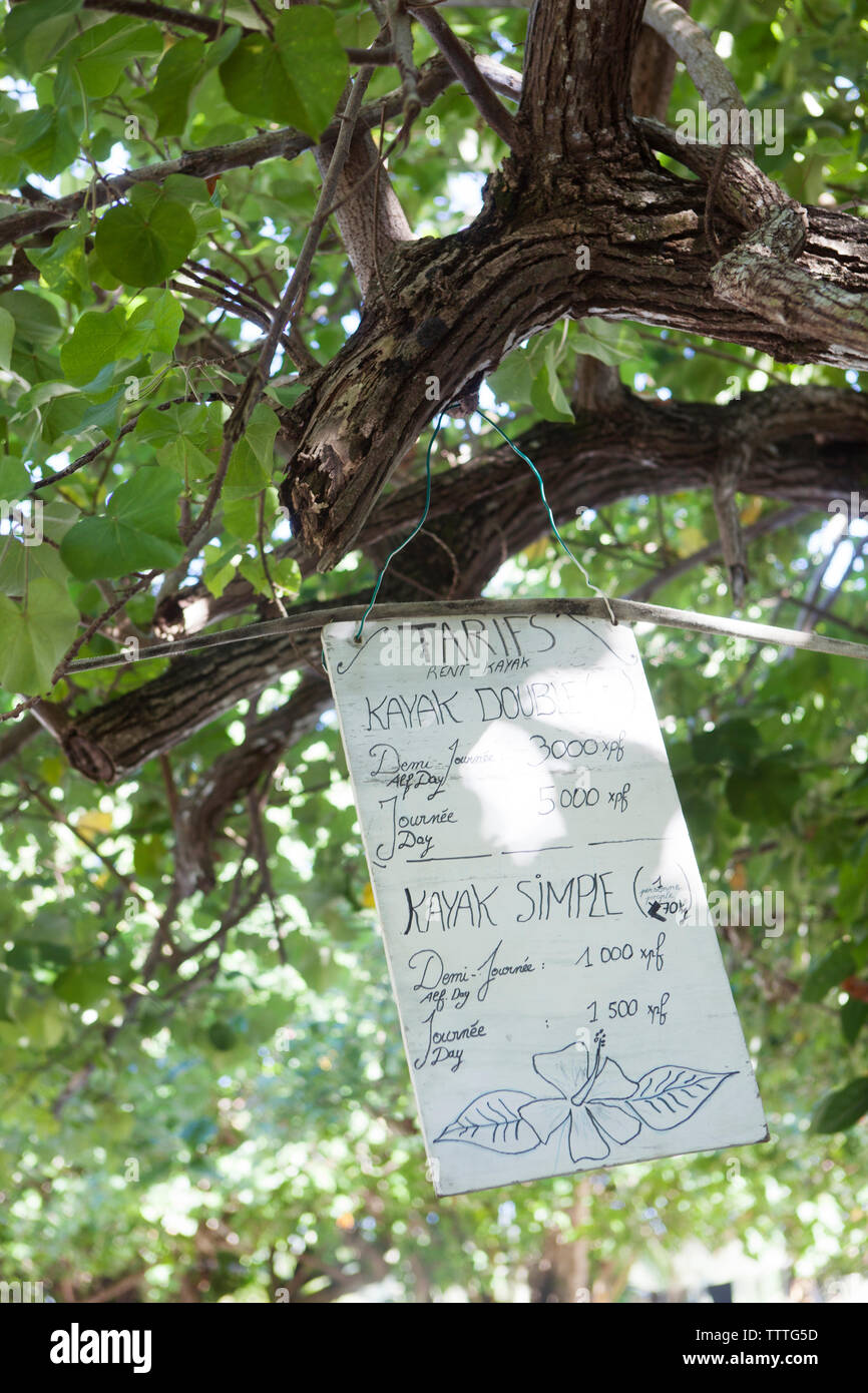 FRENCH POLYNESIA, Moorea. A Kayak for rent price sign at a local beach ...