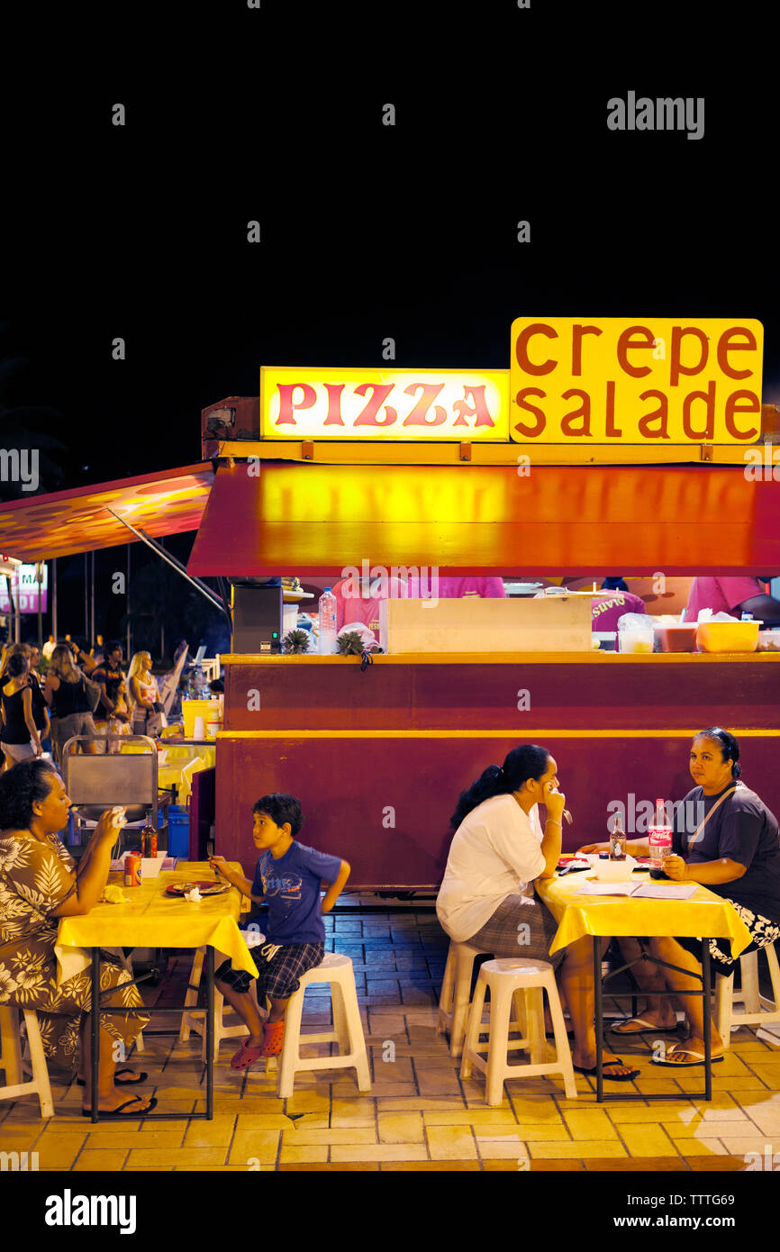 FRENCH POLYNESIA, Tahiti. Roulotte Food Trucks at night at the dock in ...