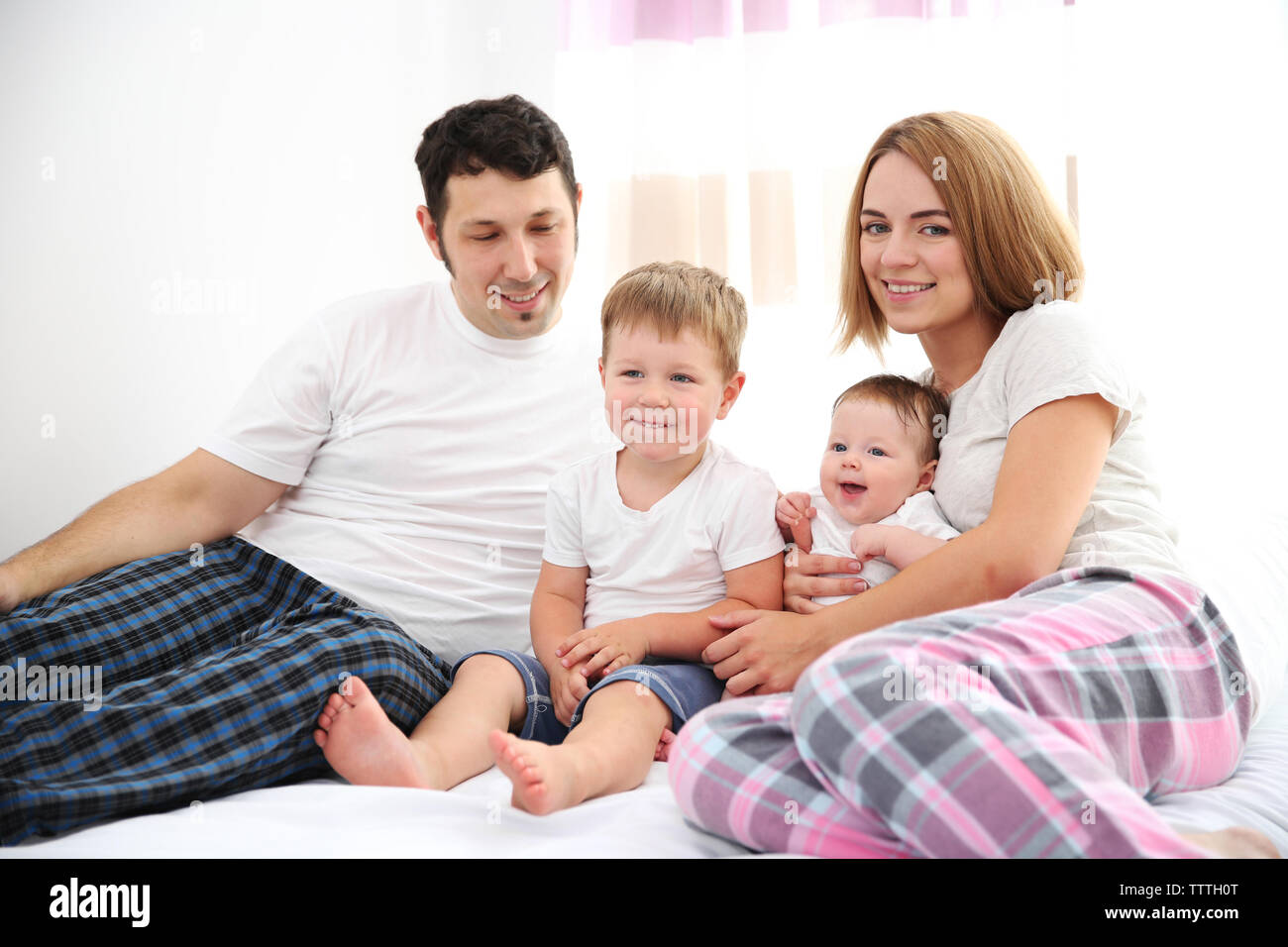 Parents with kids at home Stock Photo - Alamy