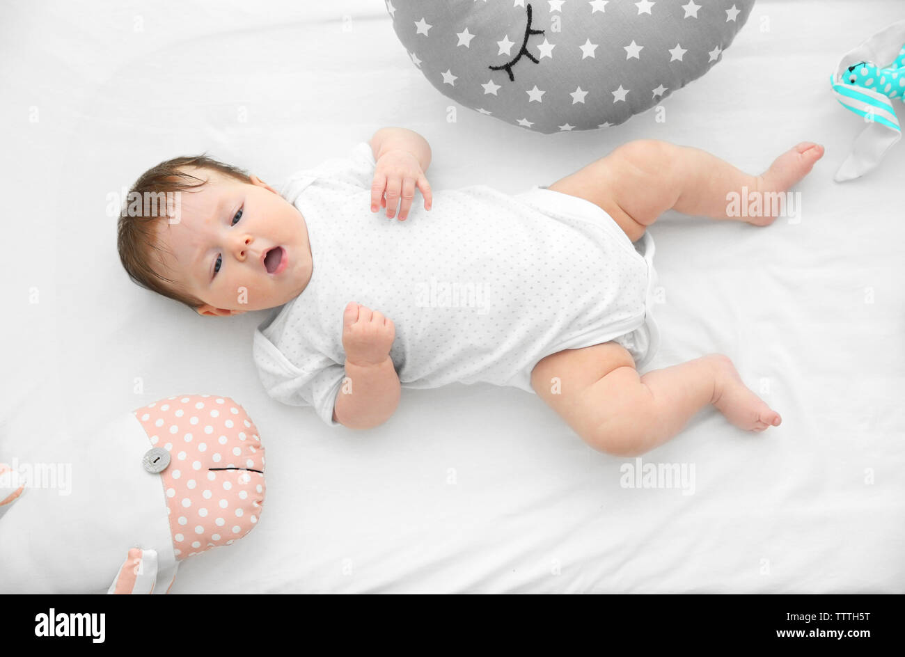 Cute baby in bed Stock Photo - Alamy