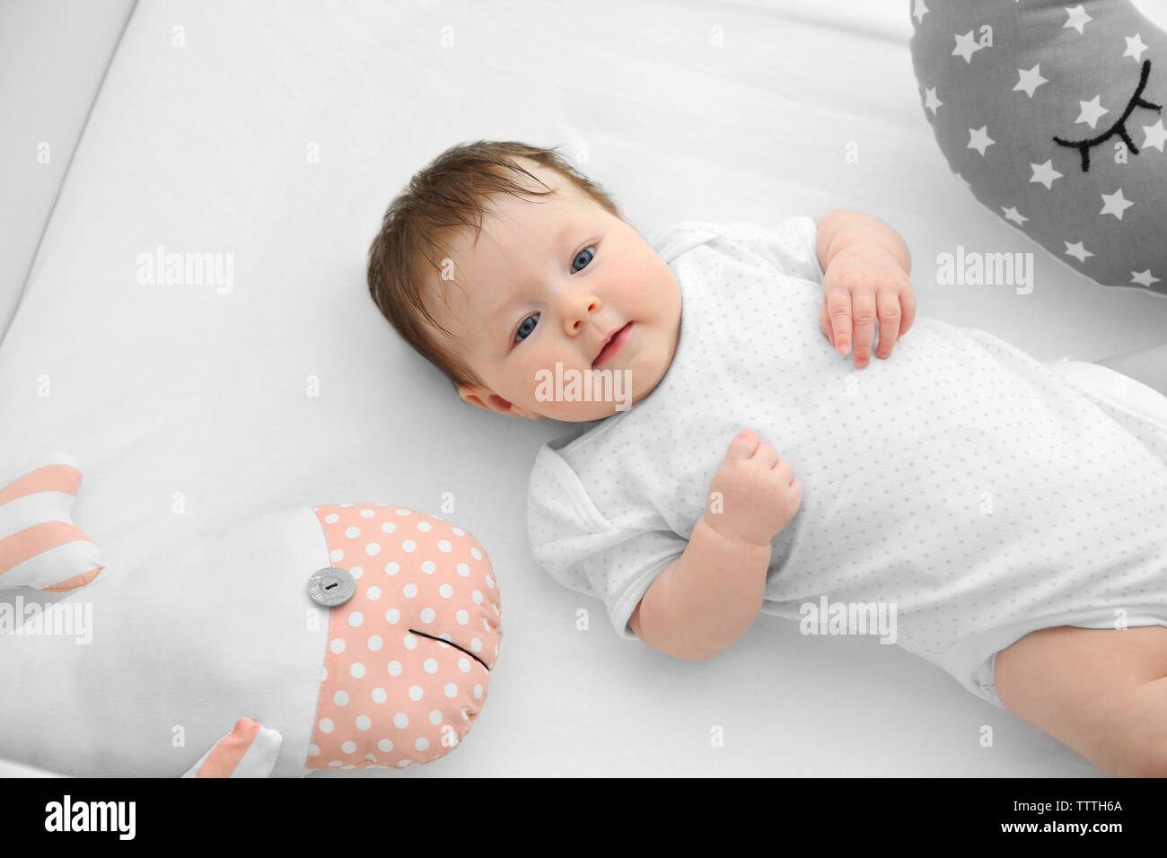 Cute baby in bed Stock Photo - Alamy