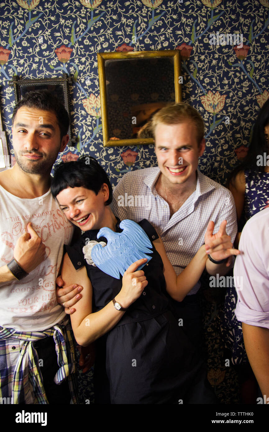 RUSSIA, Moscow. Group of friends posing for a picture at Delicatessen ...
