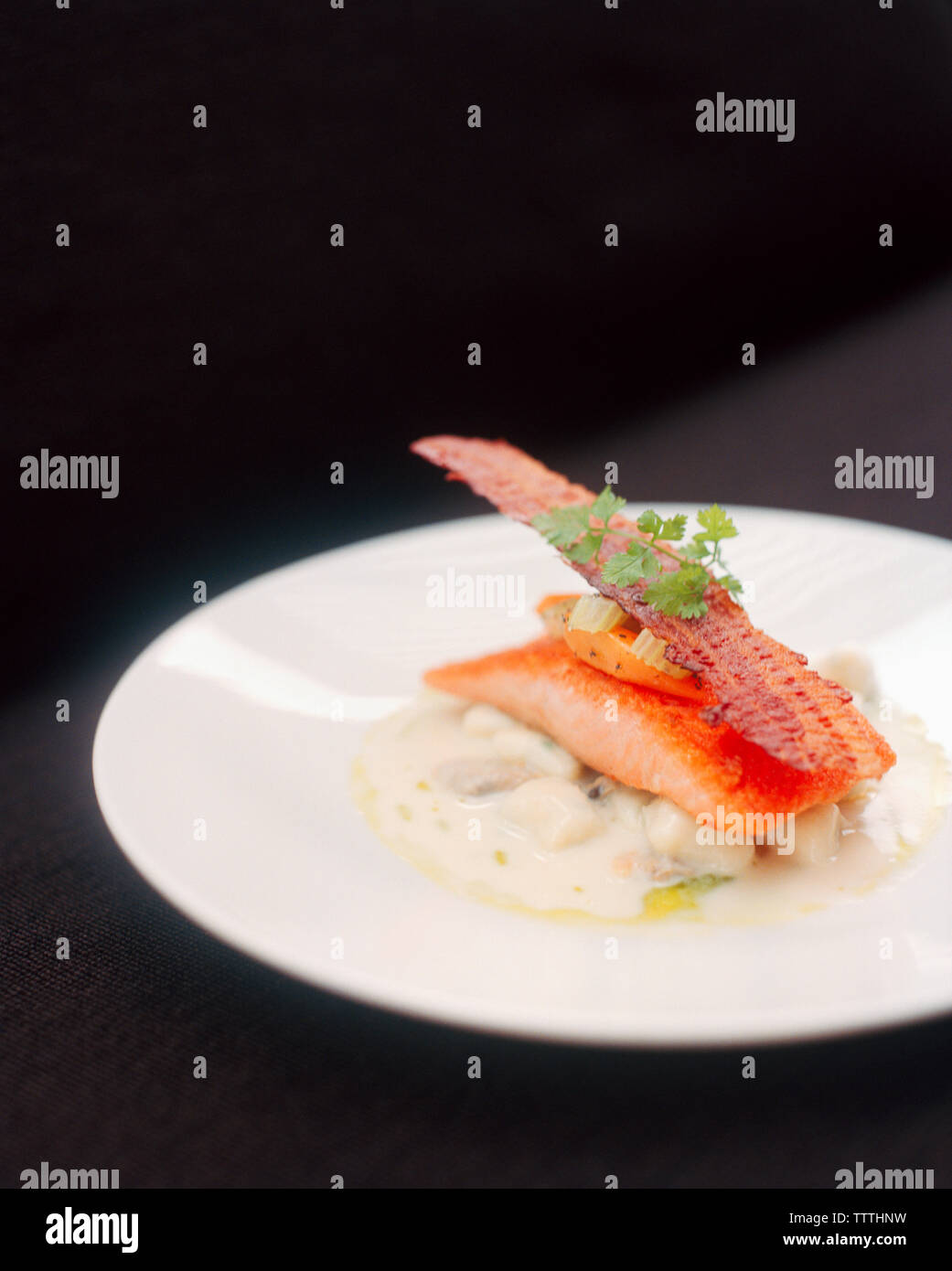 SINGAPORE, Asia, close-up of a pan seared ocean trout served in a plate ...