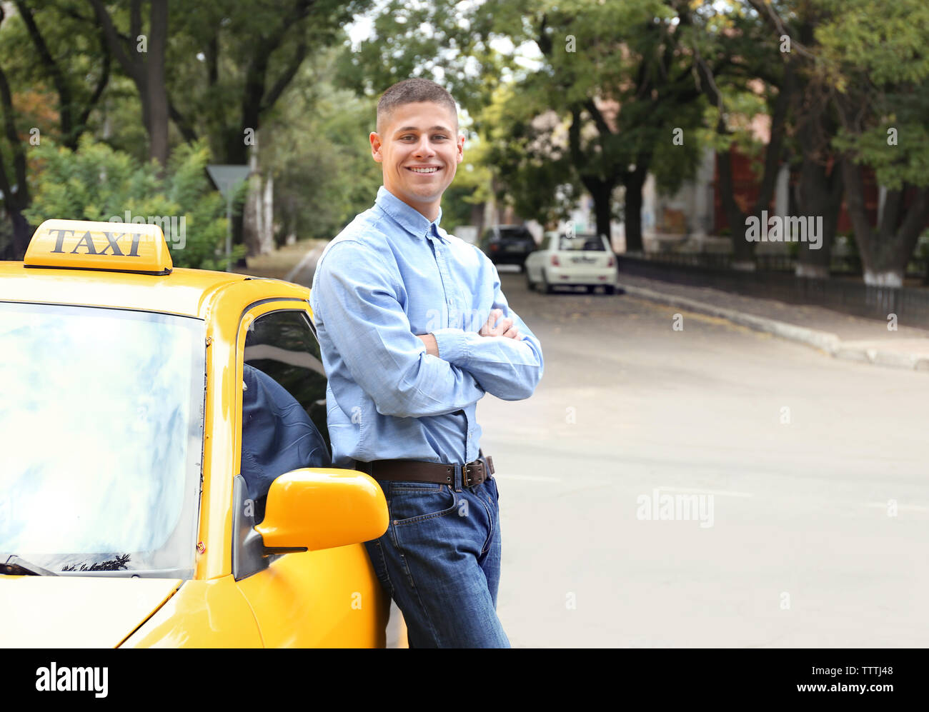 Male taxi driver near car Stock Photo - Alamy