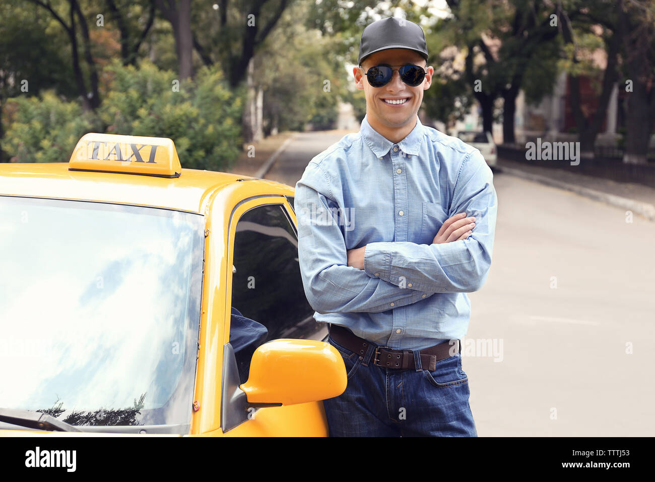 Male taxi driver near car Stock Photo - Alamy