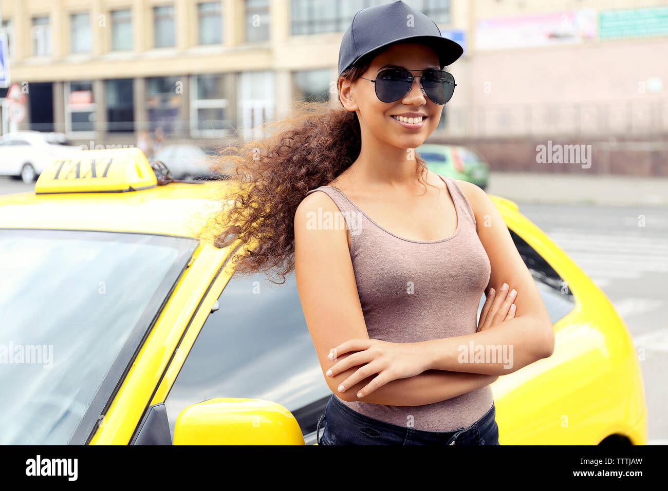 Female taxi driver near car Stock Photo - Alamy