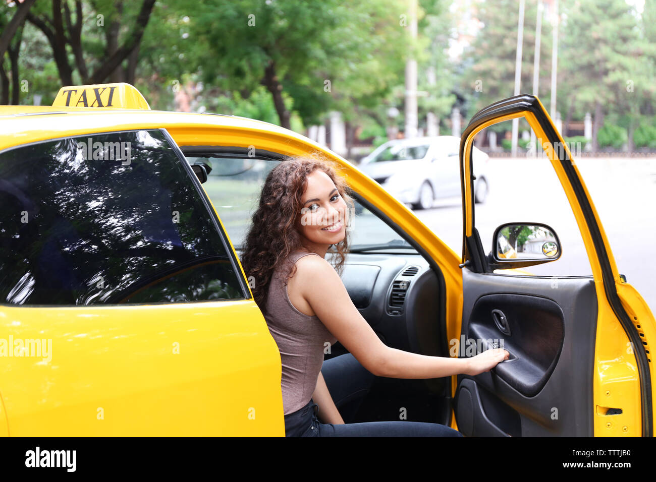 Beautiful girl in taxi car Stock Photo - Alamy