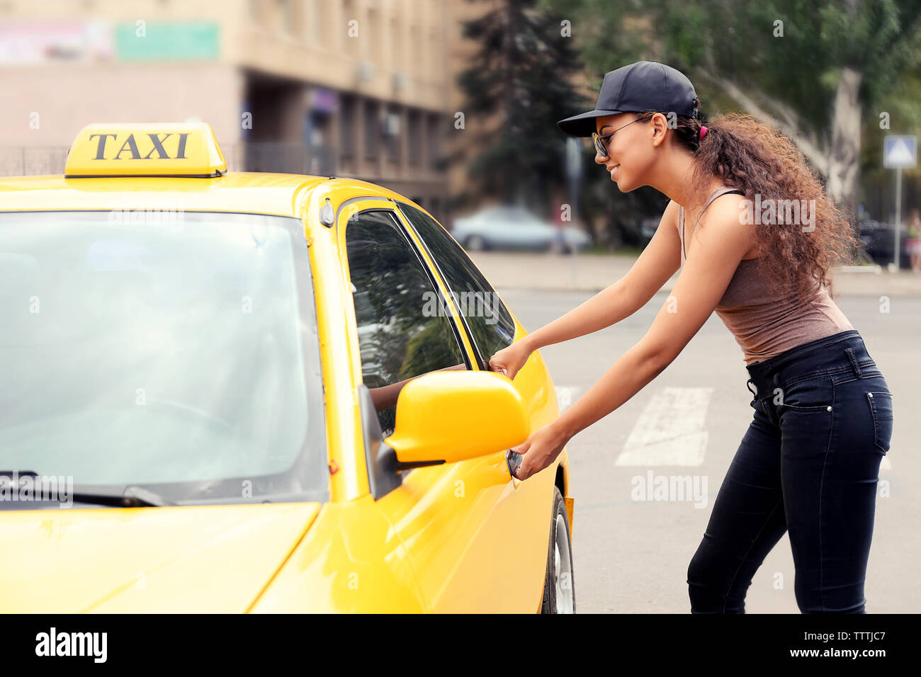 Female taxi driver near car Stock Photo - Alamy