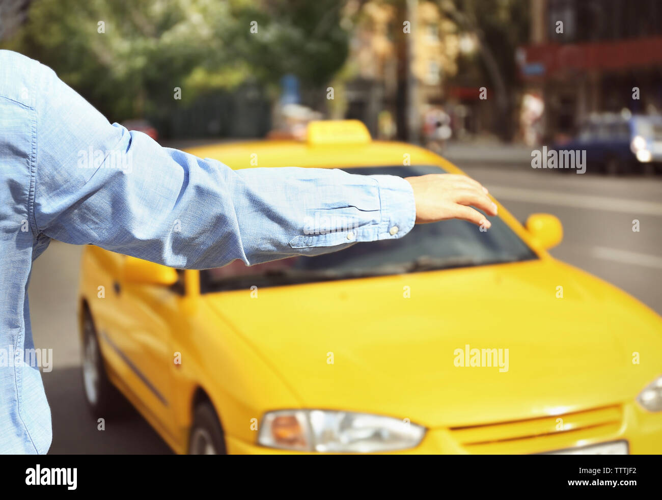 Man stopping taxi, outdoor Stock Photo - Alamy