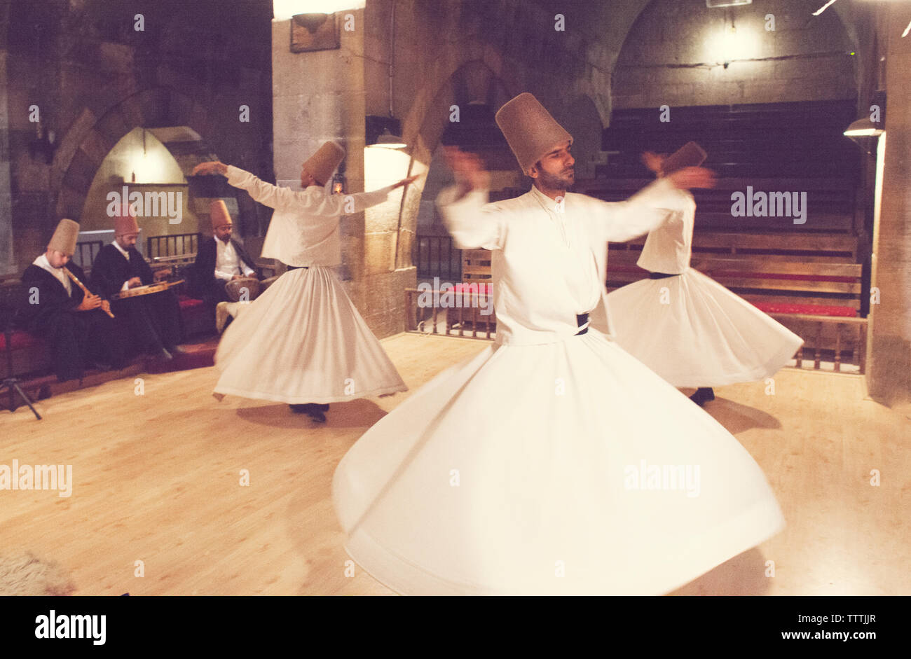 Whirling Dervishes dancing on hardwood floor Stock Photo - Alamy