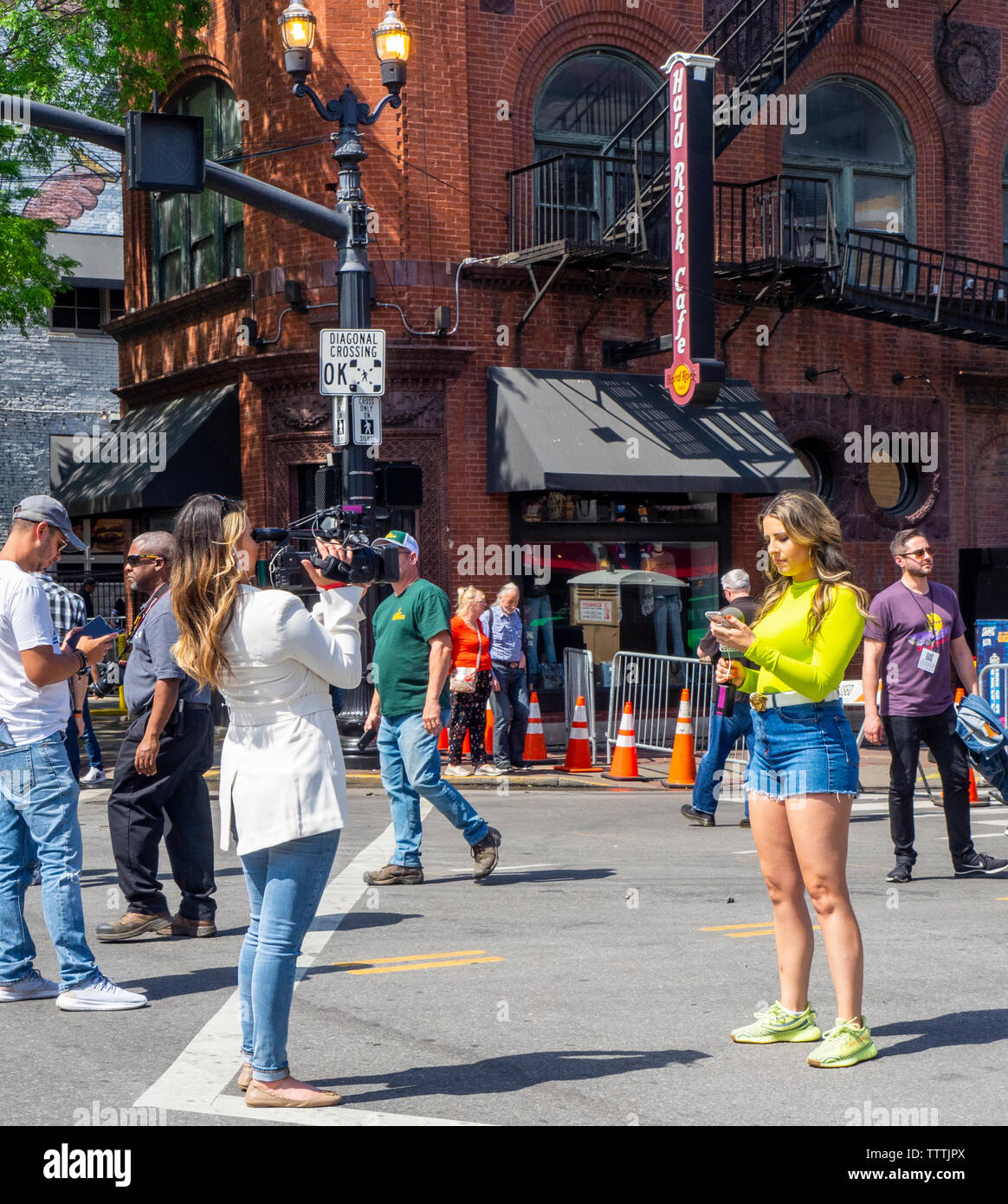 Female television reporter recording a news segment on Broadway at the ...