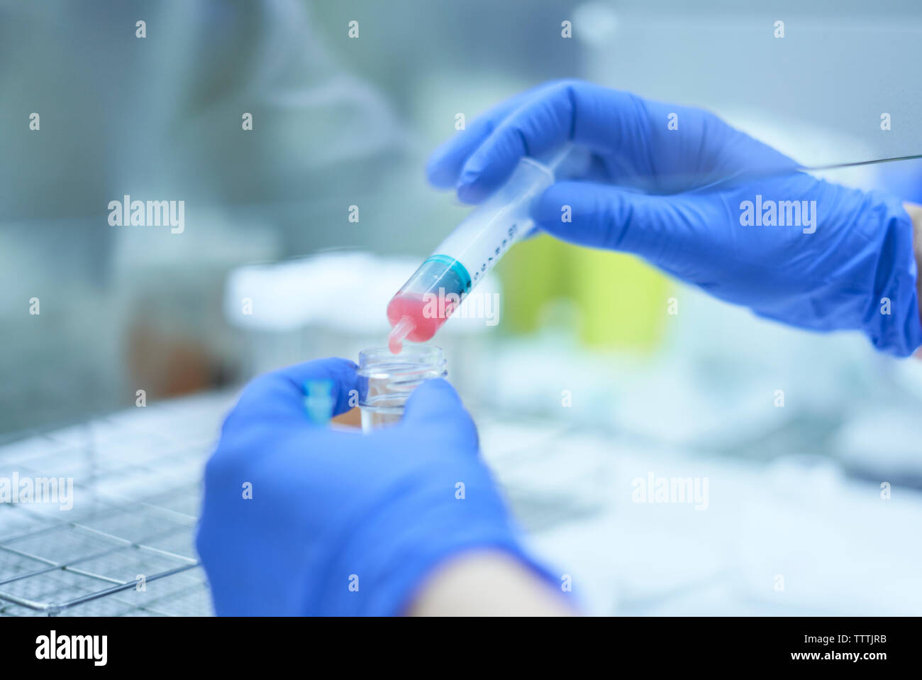hand pouring blood in to plastic bottle, Hospital laboratory Stock ...