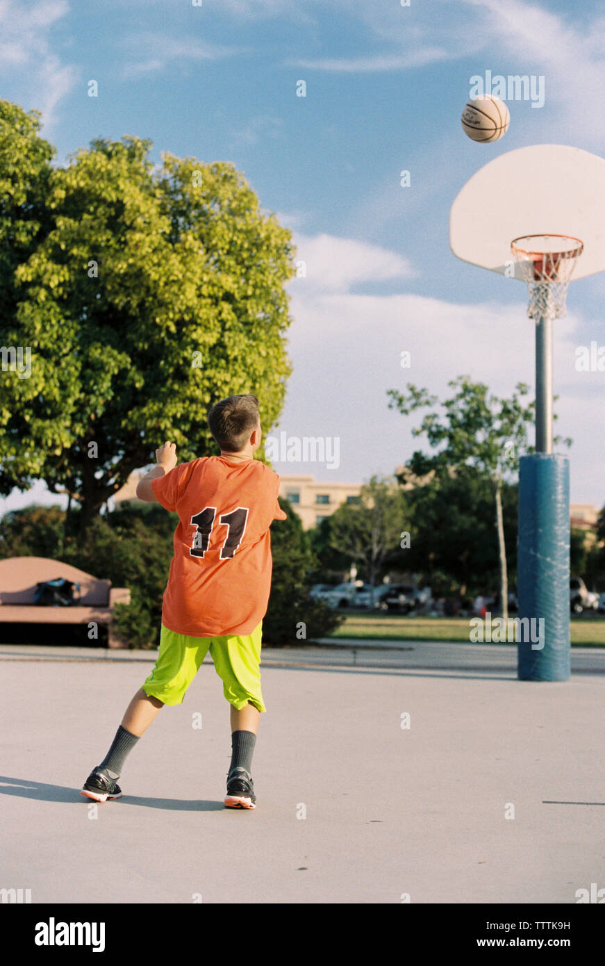 Boy throwing basketball hoop hi-res stock photography and images - Alamy