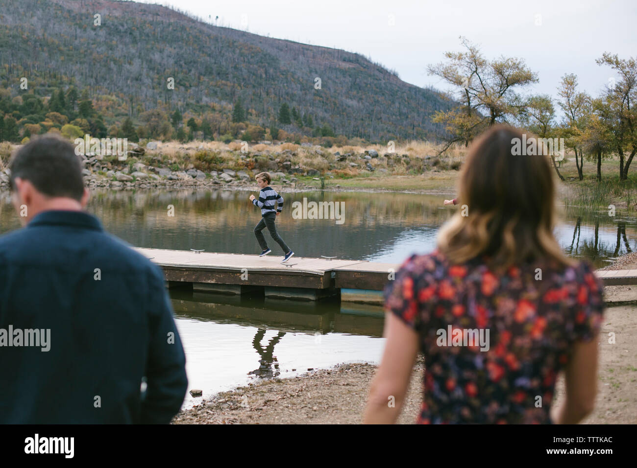 Boy running into lake hi-res stock photography and images - Alamy