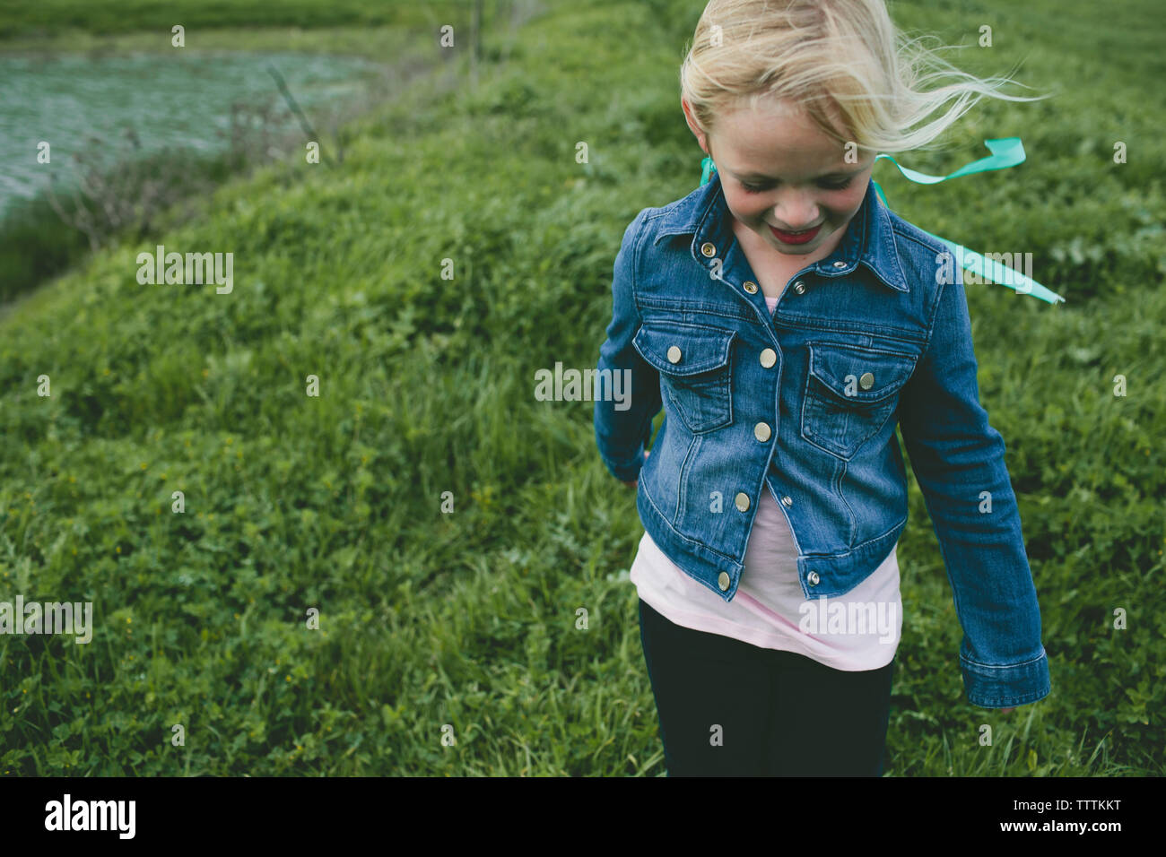 Walking smiling field hi-res stock photography and images - Alamy