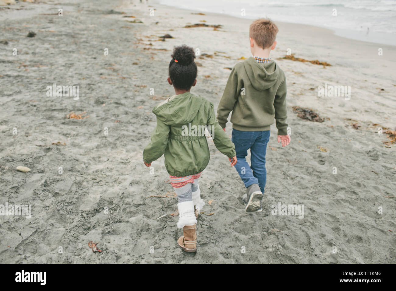 Rear view brother sister walking hi-res stock photography and images ...