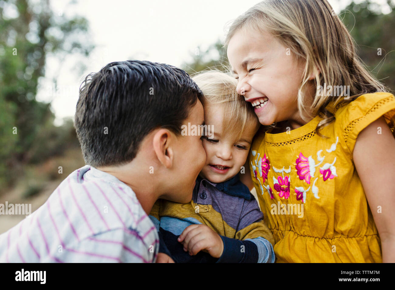Side view cheerful siblings hi-res stock photography and images - Alamy