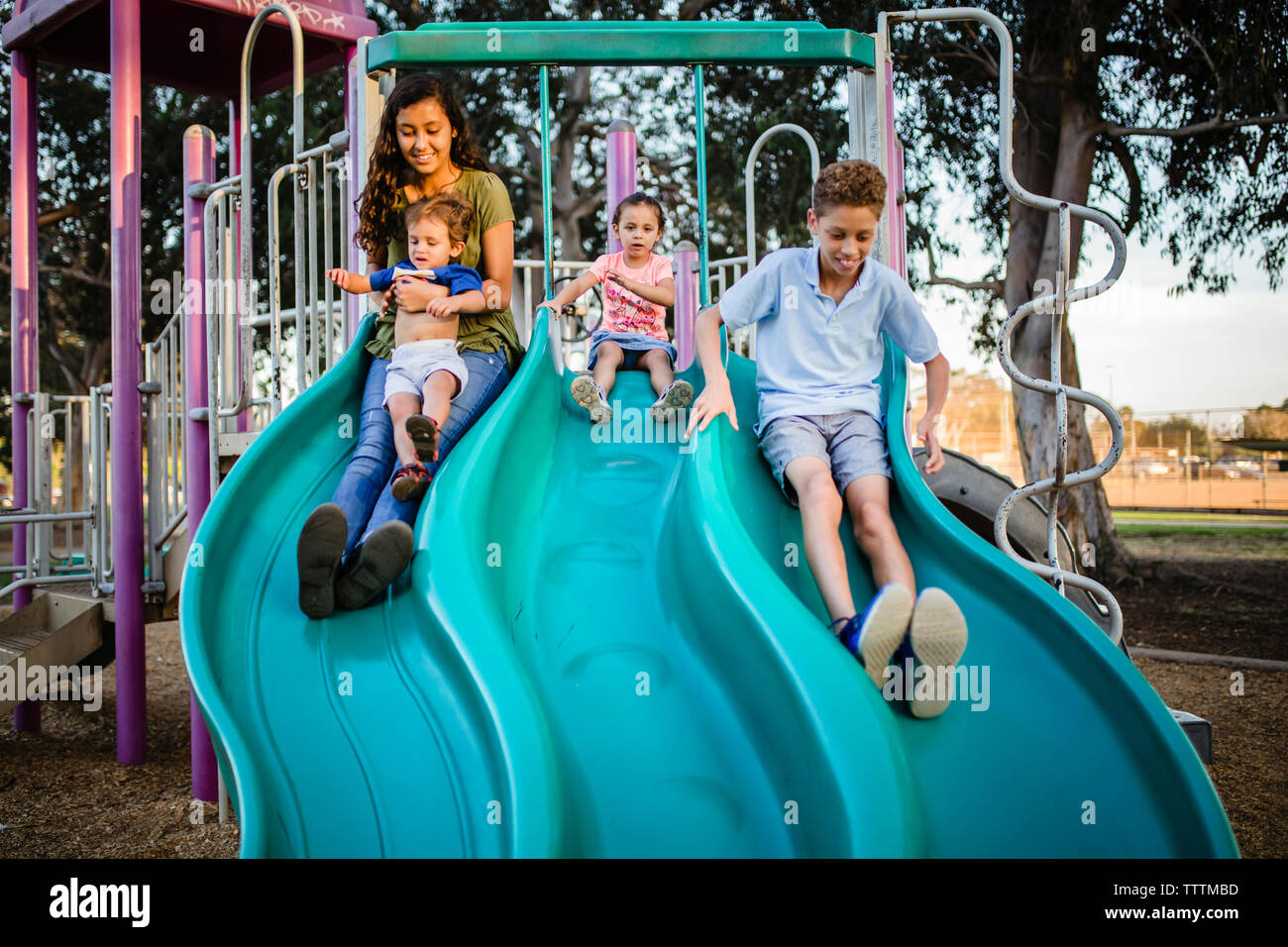 Playground slides hi-res stock photography and images - Alamy