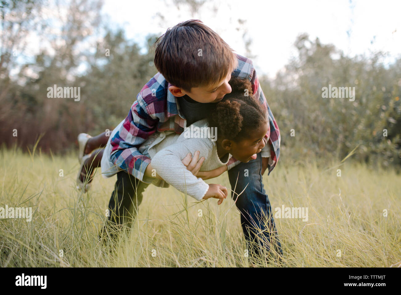 Boy carrying girl hi-res stock photography and images - Alamy