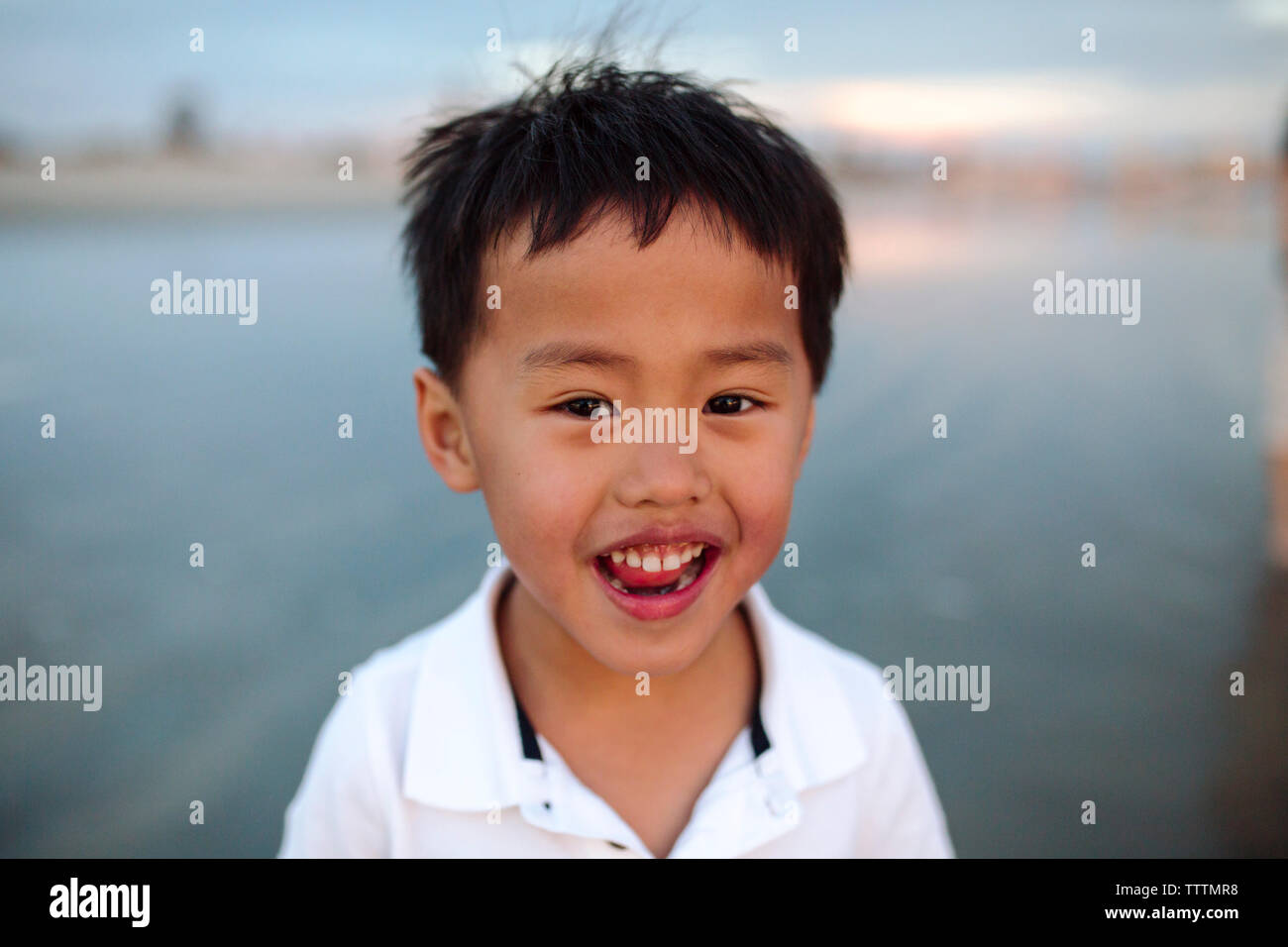 Boy at beach sunset hi-res stock photography and images - Alamy