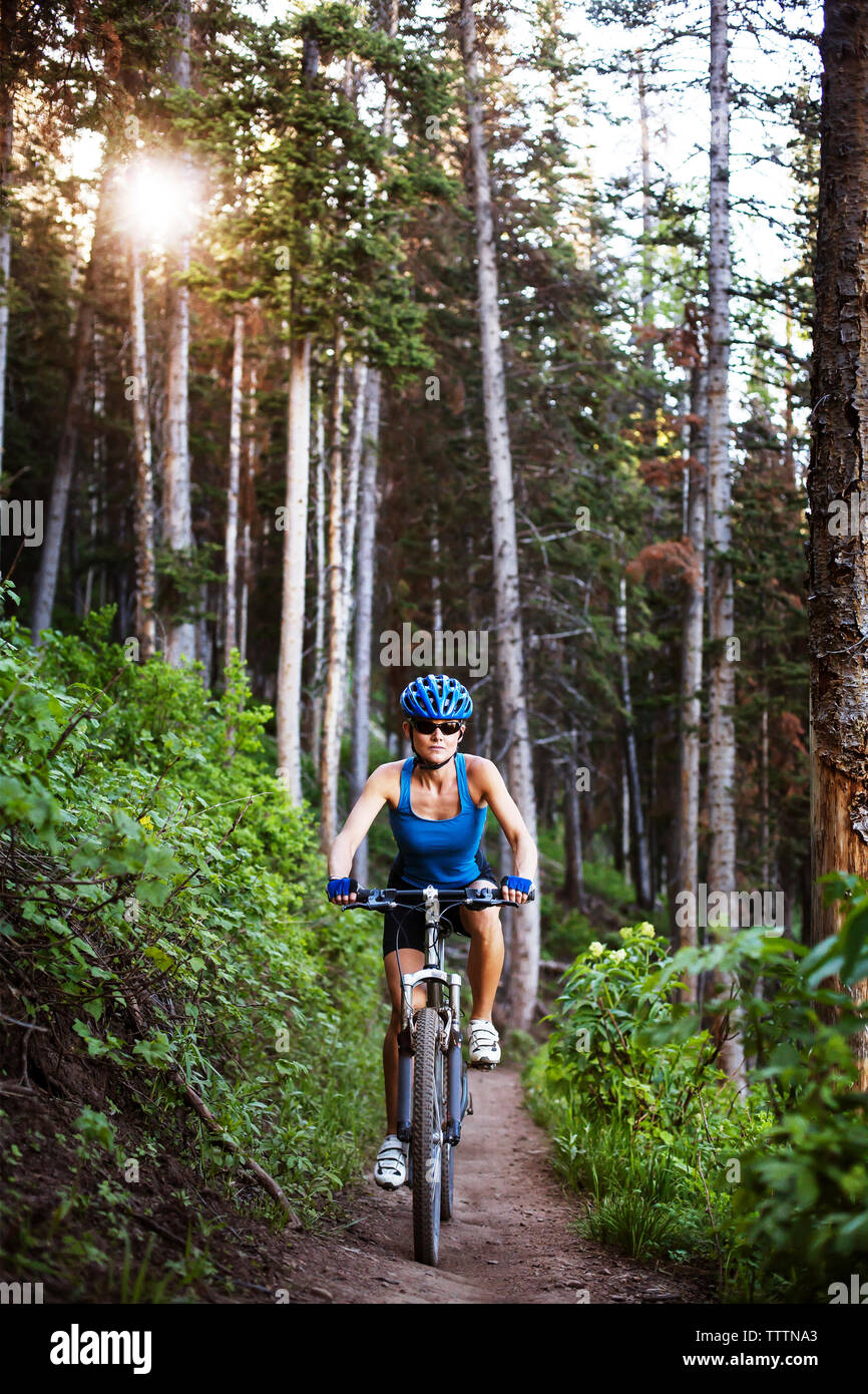 Female athlete riding bicycle hi-res stock photography and images - Alamy