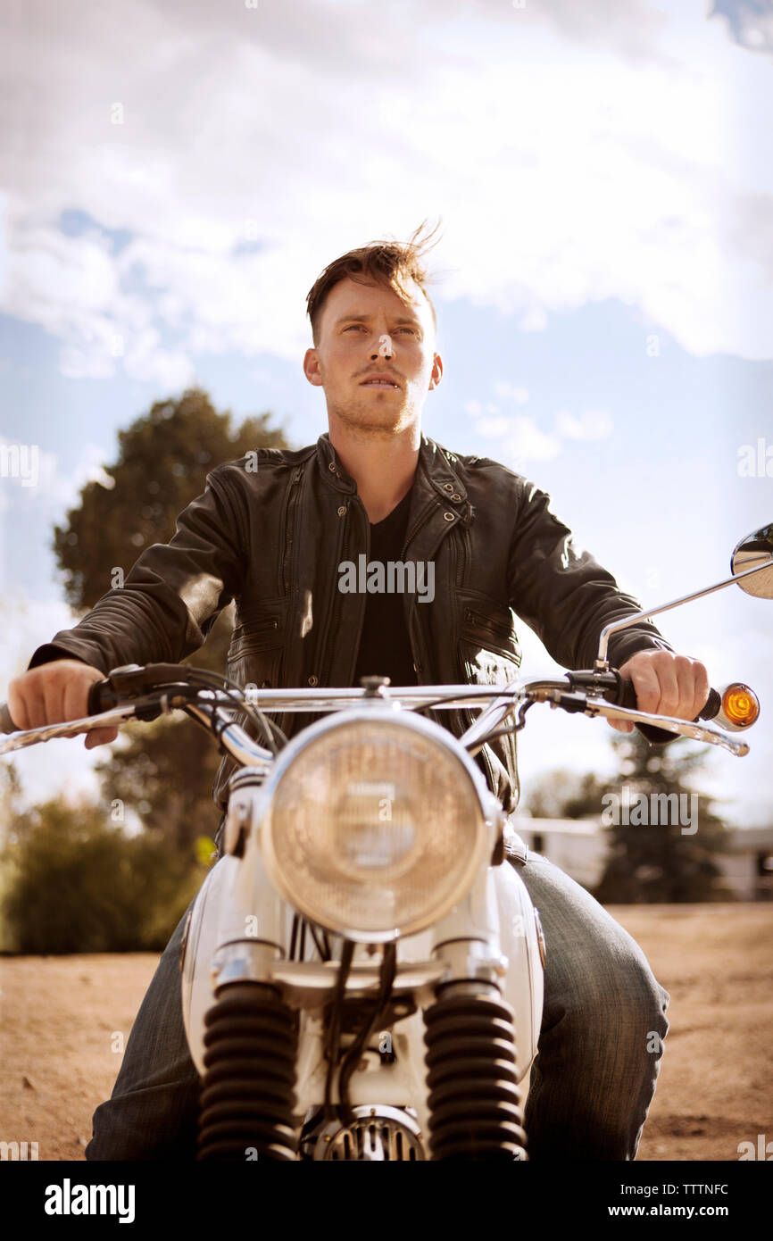 Biker riding motorcycle low angle hi-res stock photography and images ...