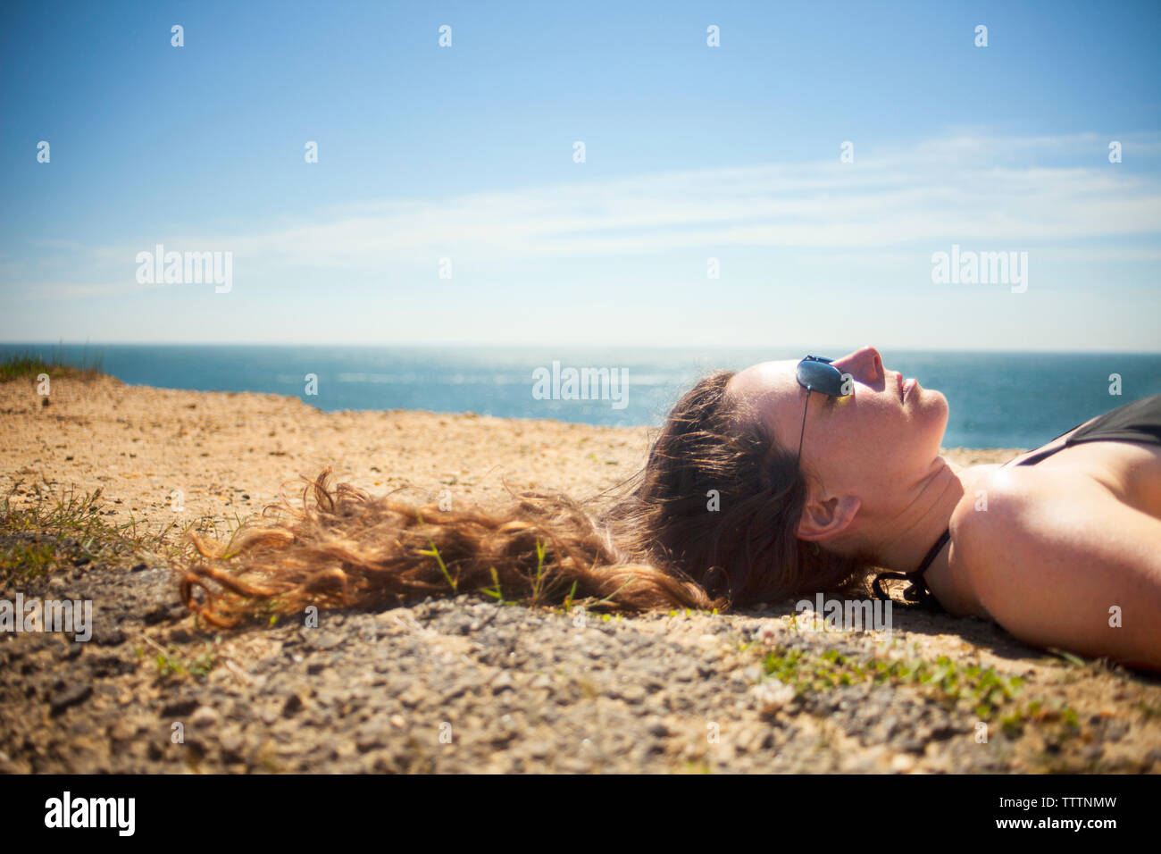 30 years old woman lying down beach hi-res stock photography and images ...