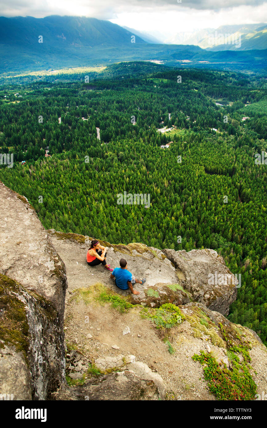 Group people sitting on cliff hi-res stock photography and images - Alamy