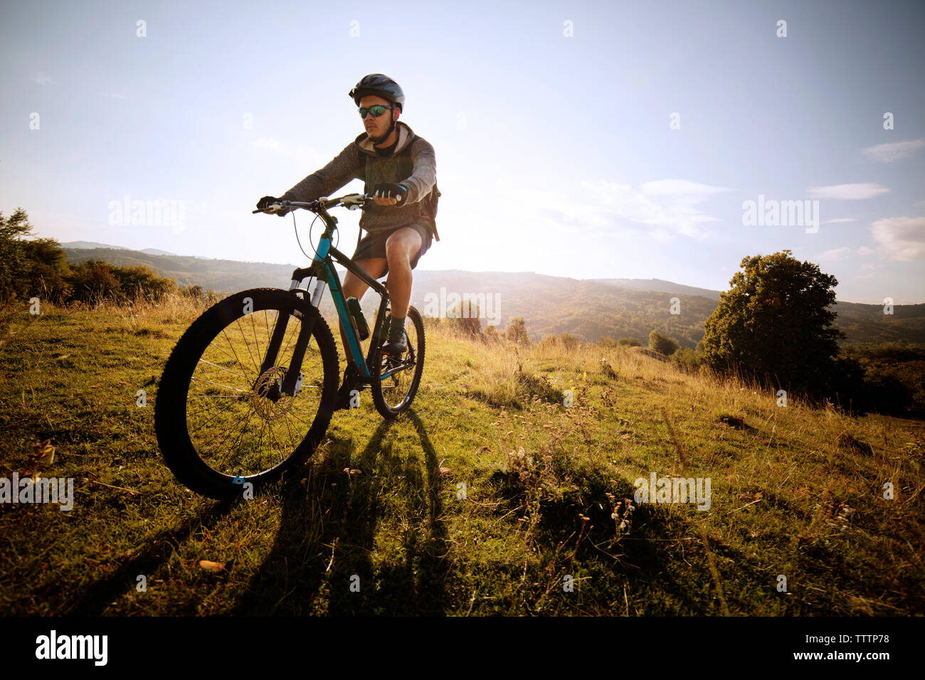 Cycling on grass hi-res stock photography and images - Alamy