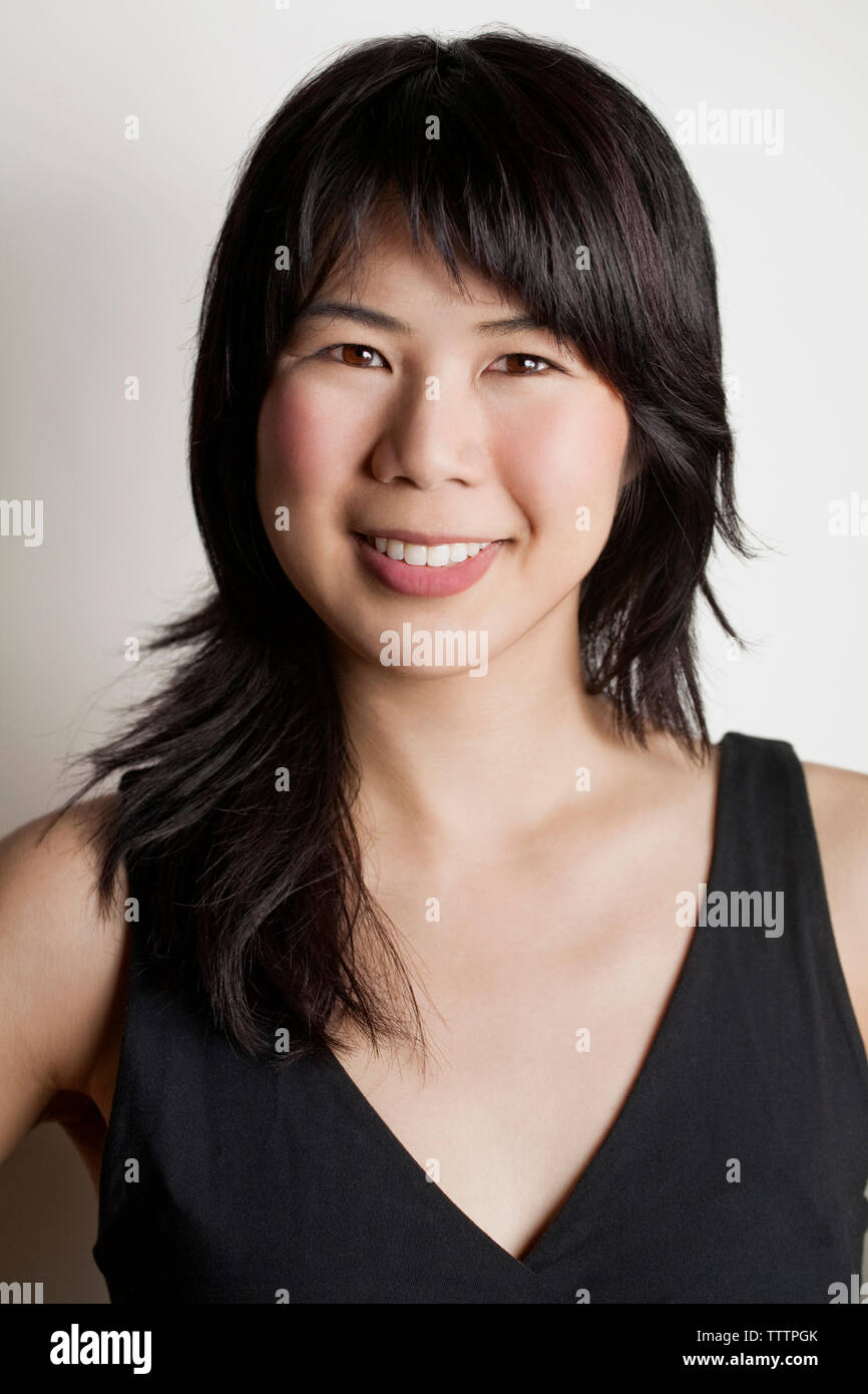 Portrait of woman against white background Stock Photo - Alamy