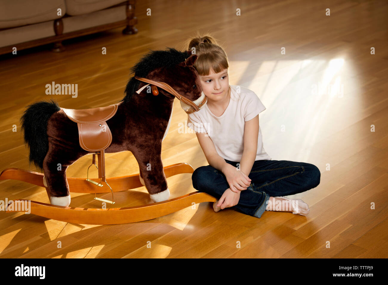 Girl on rocking horse hi-res stock photography and images - Alamy