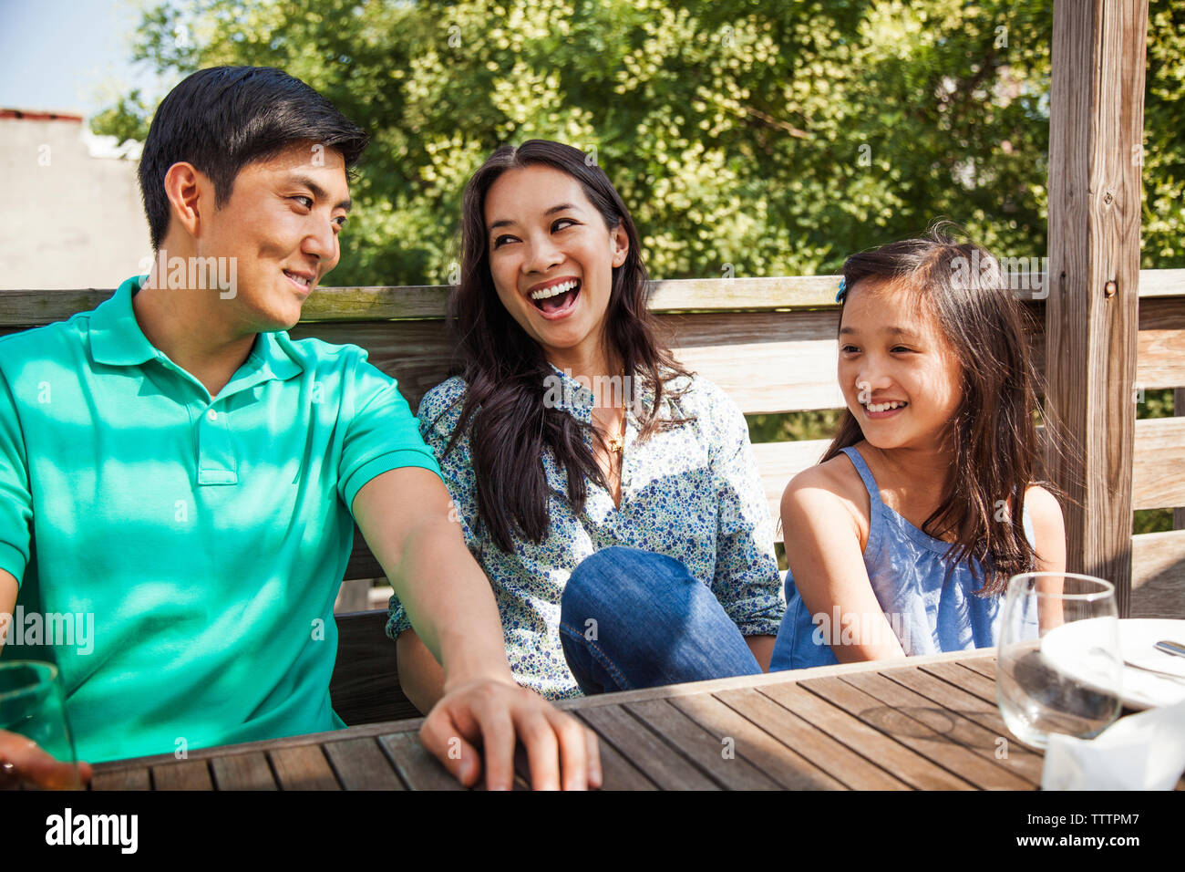 Family sitting table hi-res stock photography and images - Alamy