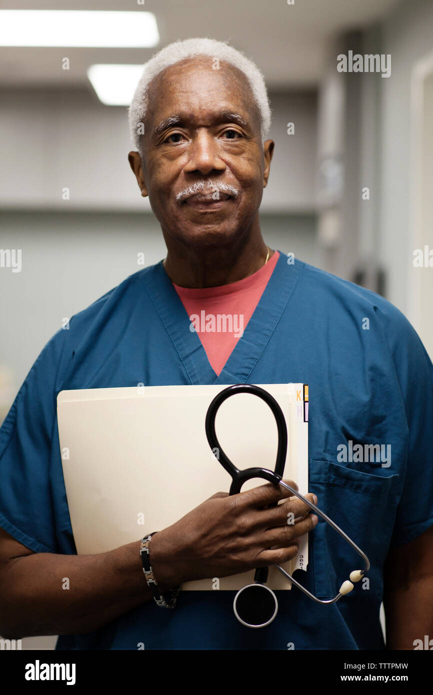 Portrait of doctor standing in hospital Stock Photo - Alamy