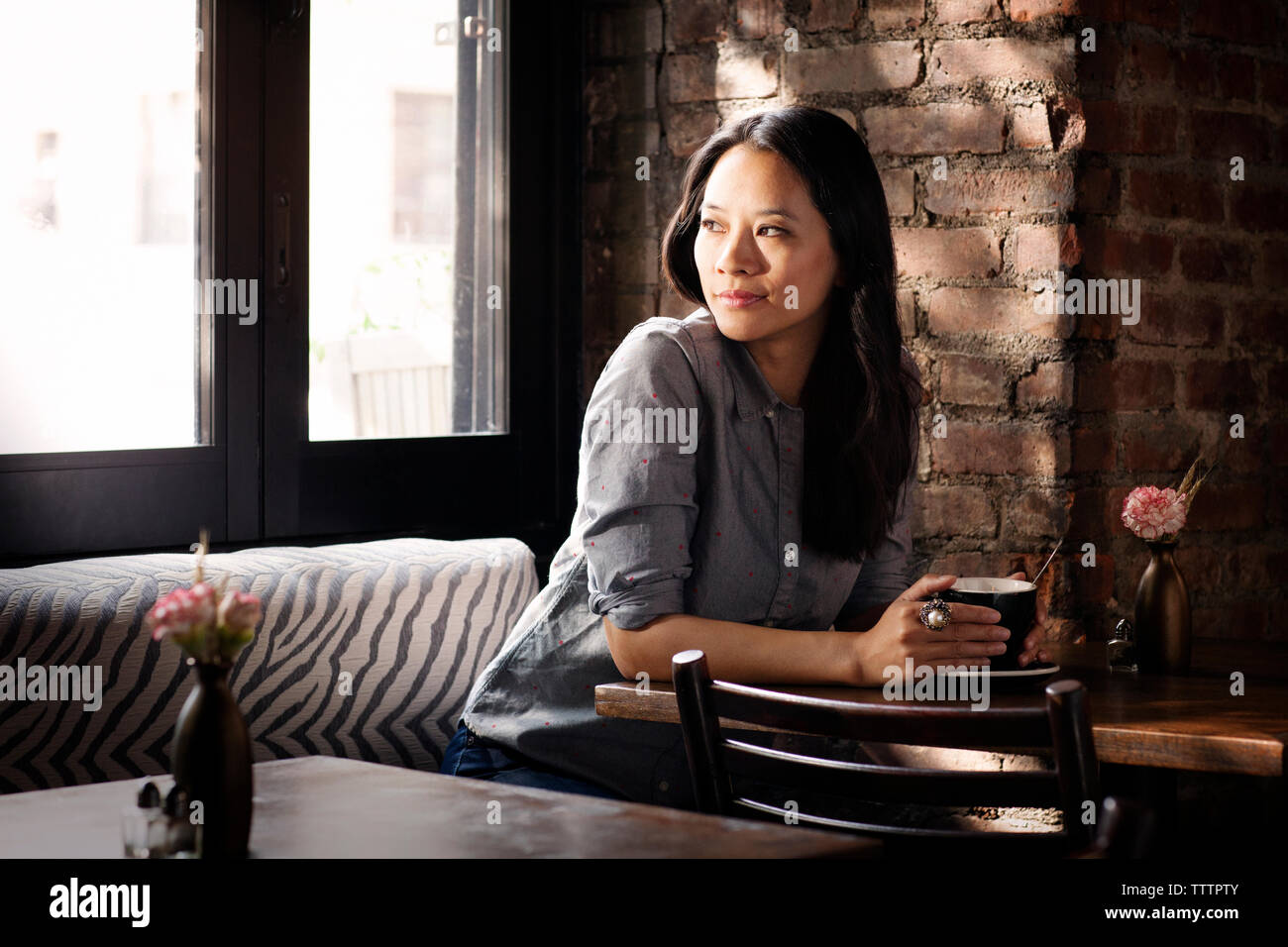 Asian woman sitting cafe hi-res stock photography and images - Alamy