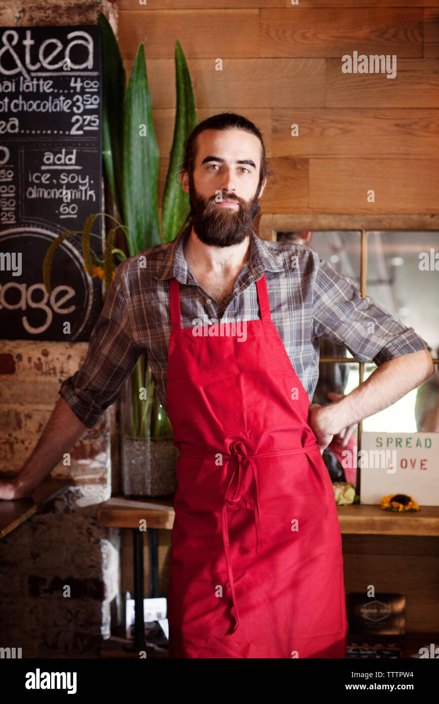 Portrait of man standing in cafe Stock Photo - Alamy