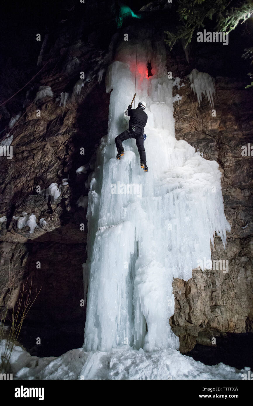 Ice climbing on frozen waterfall hi-res stock photography and images ...