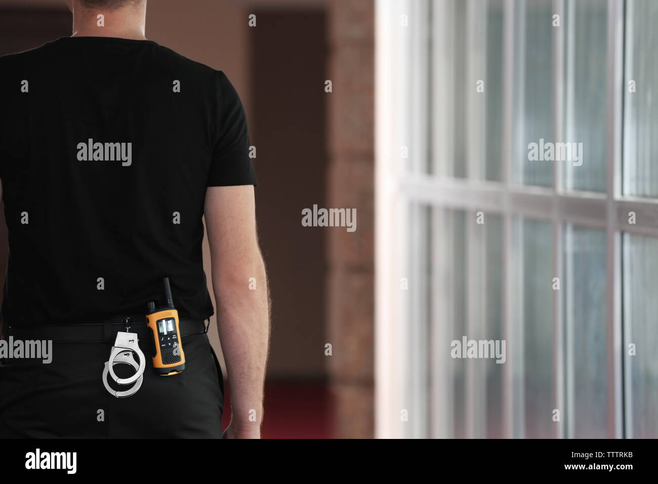 Security man standing back, closeup Stock Photo - Alamy