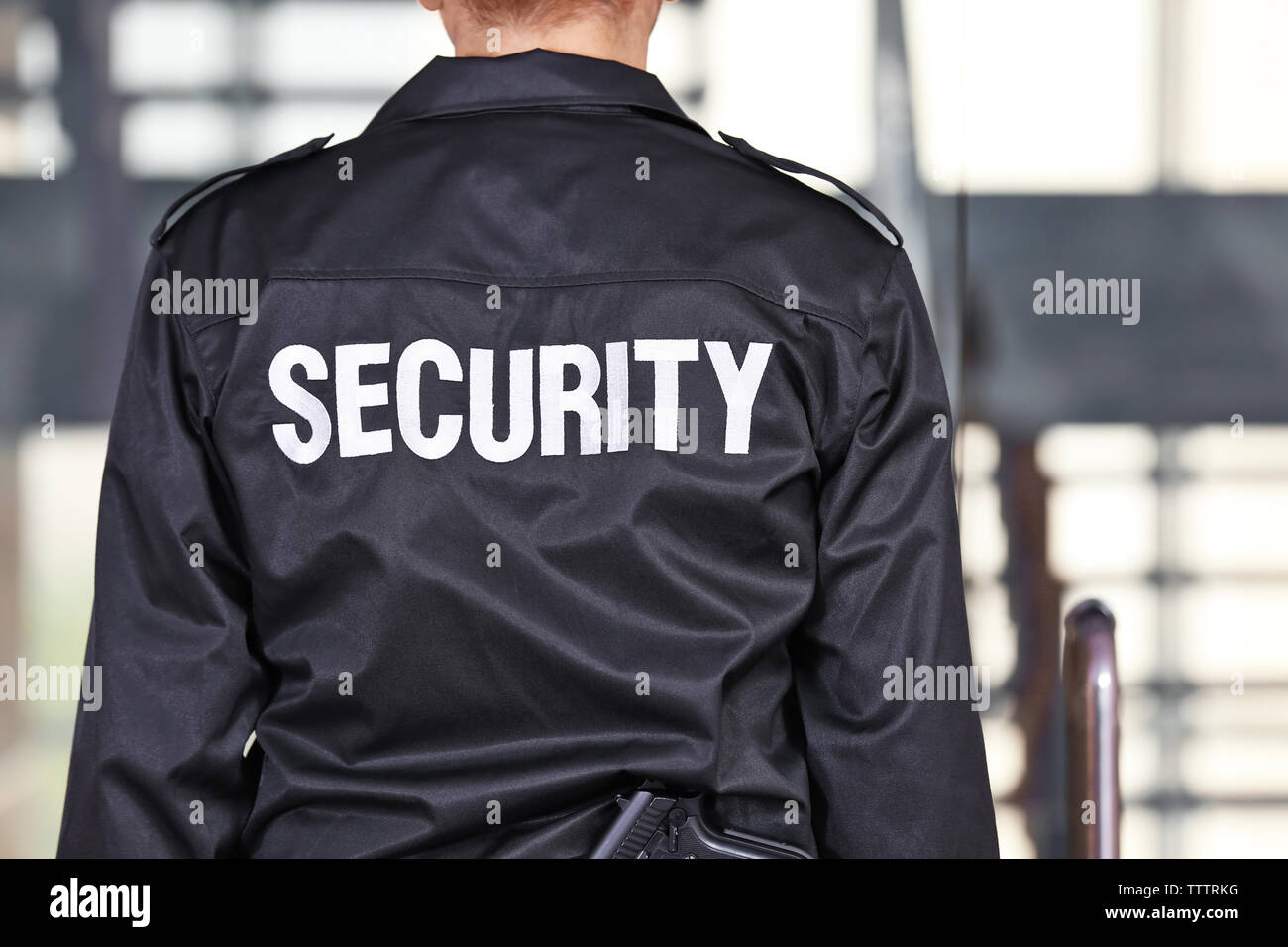 Security man standing back, closeup Stock Photo - Alamy