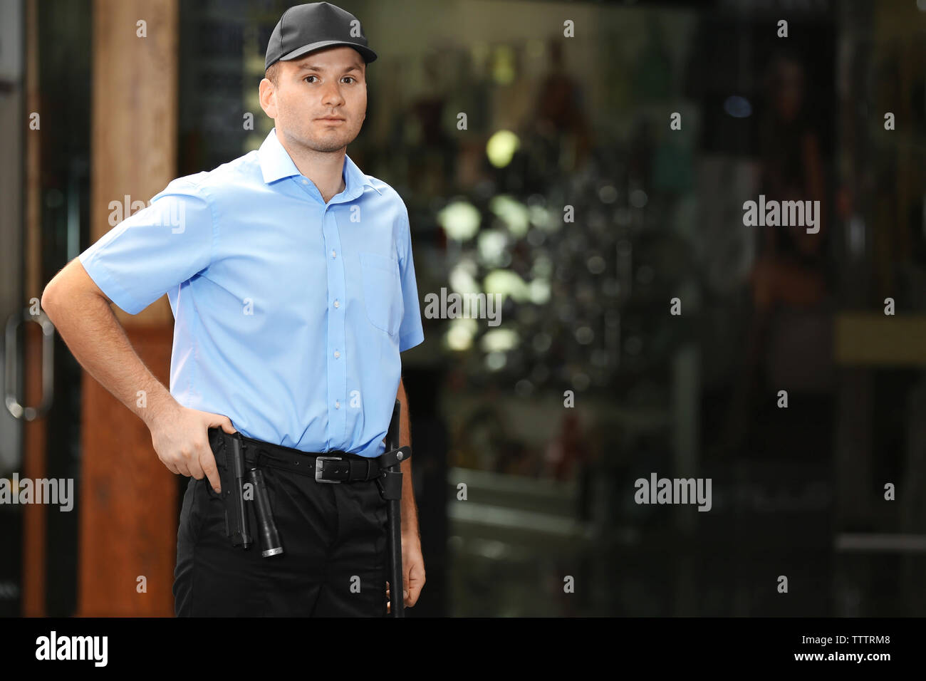 Security man standing indoors Stock Photo - Alamy