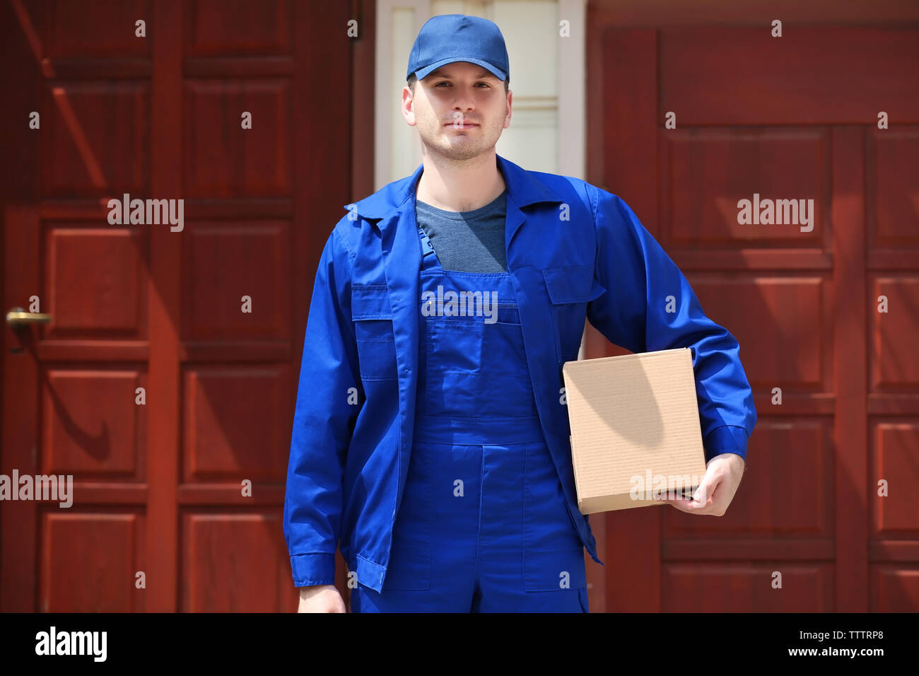 Young deliverer in uniform hi-res stock photography and images - Alamy