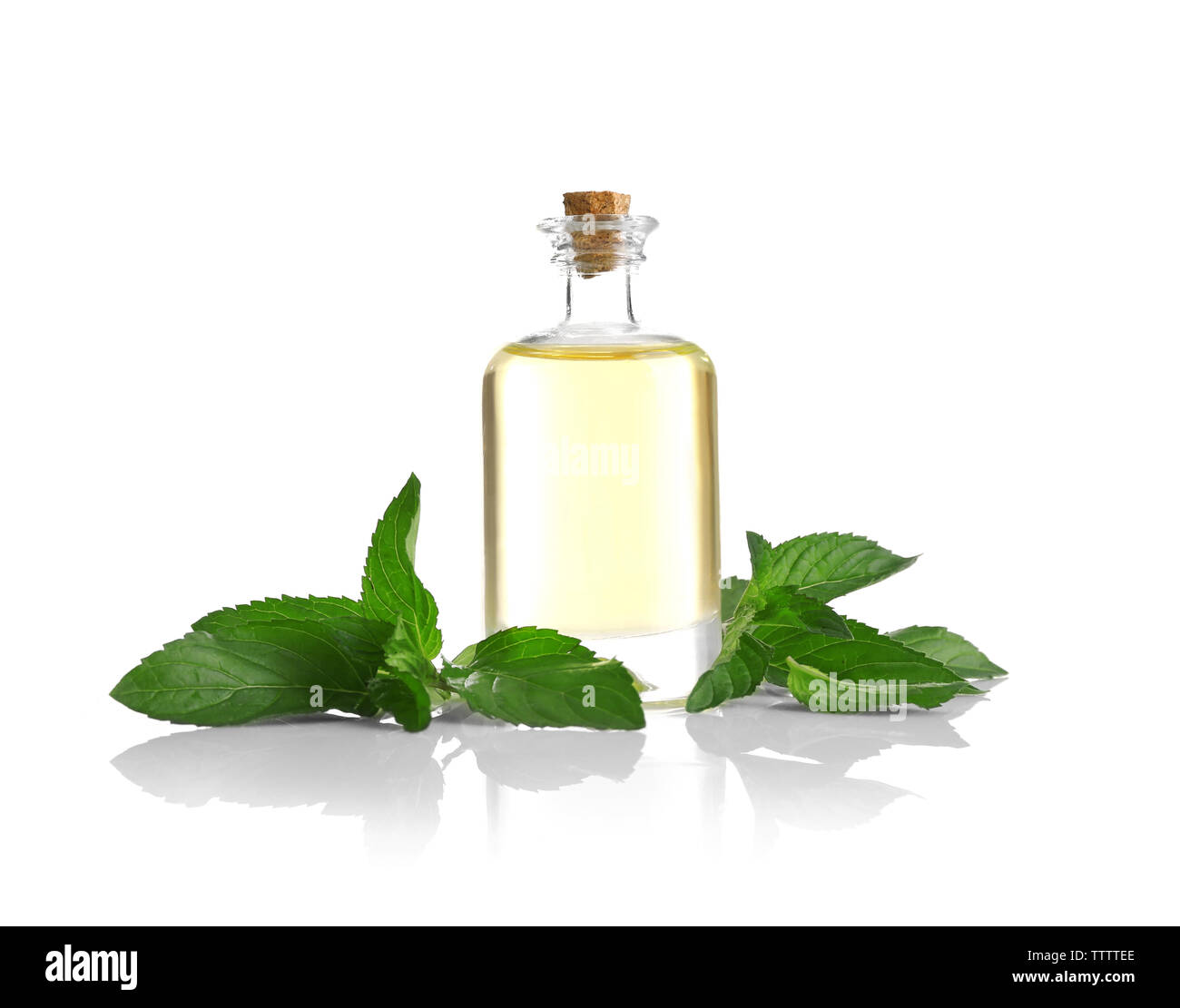 Essential aroma oil in glass bottle with fresh mint leaves on white ...