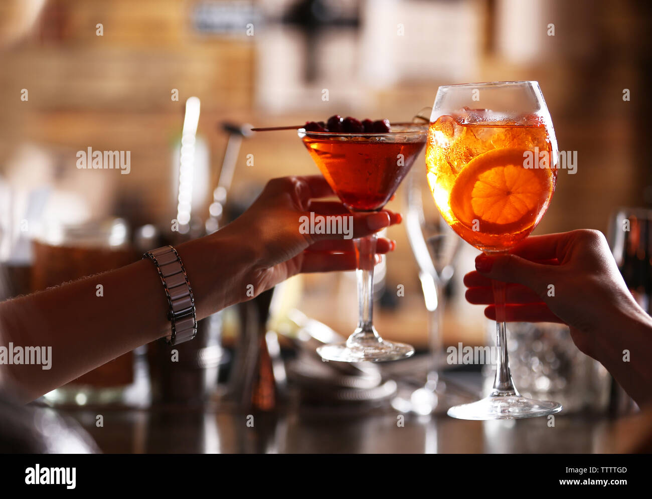 Women toasting with cocktails in bar Stock Photo - Alamy