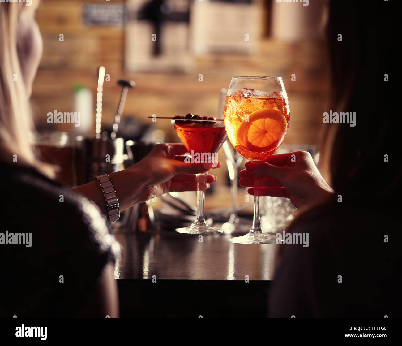 Women toasting with cocktails in bar Stock Photo - Alamy