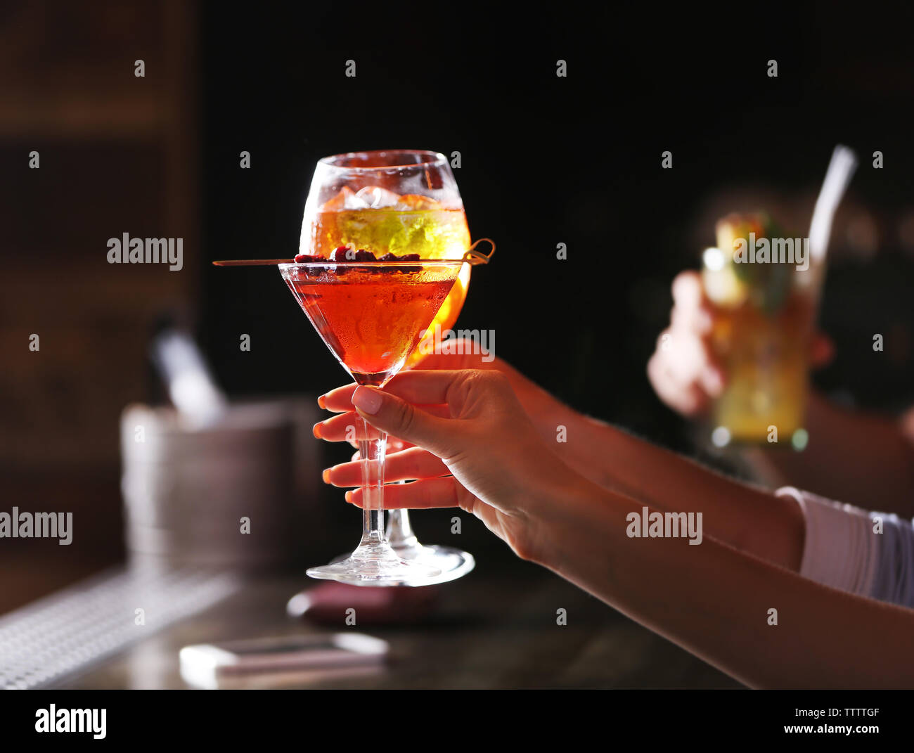 Women toasting with cocktails in bar Stock Photo - Alamy