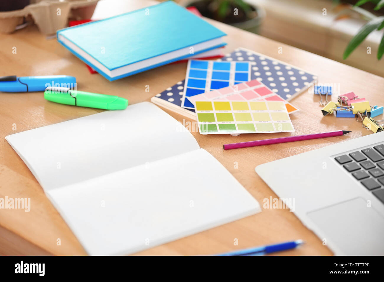 Designer workplace with colour palette and laptop Stock Photo - Alamy