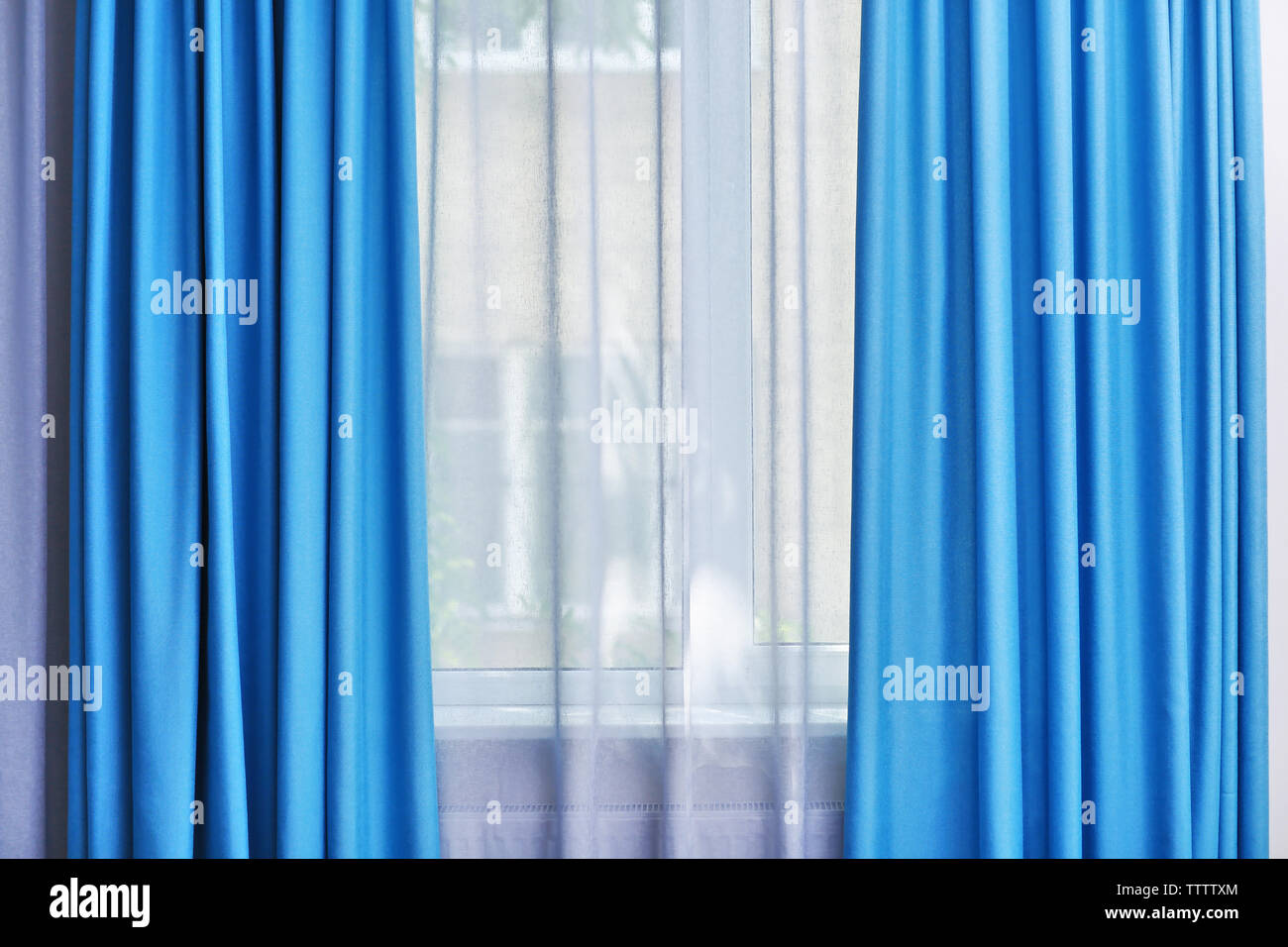 Room window with white and blue curtains Stock Photo - Alamy