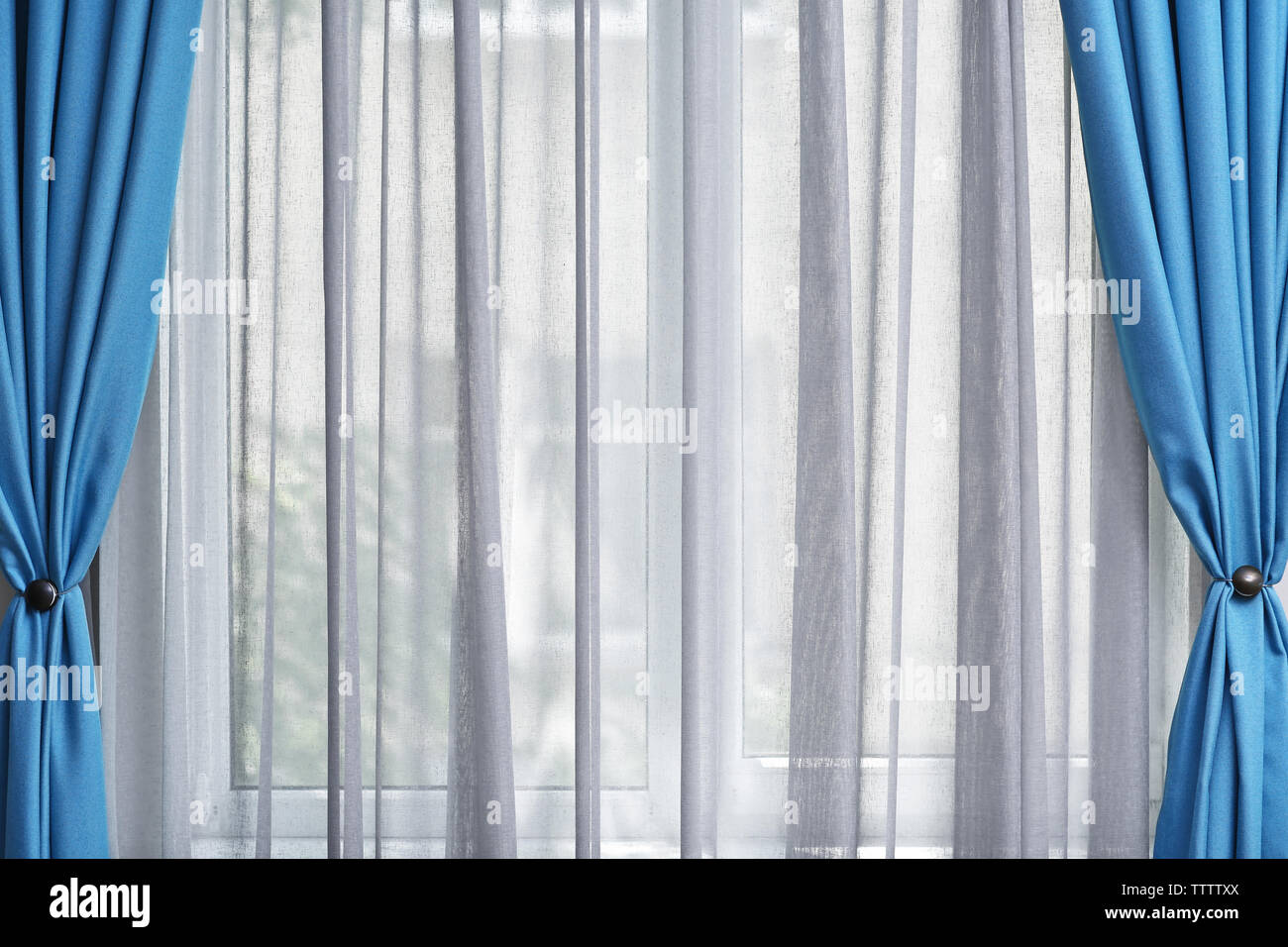 Room window with white and blue curtains Stock Photo - Alamy